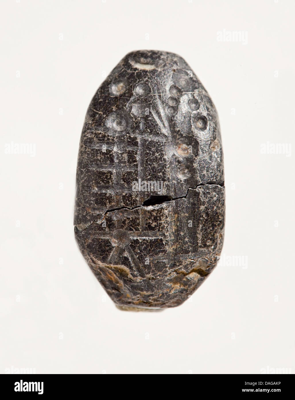 This ancient stamp seal features intricate engraving, typical of the ...