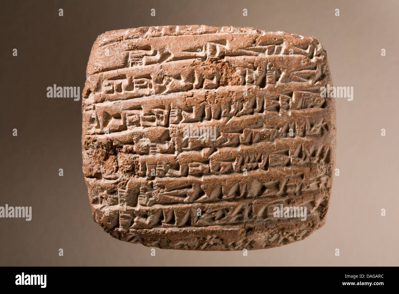 A clay tablet featuring cuneiform writing, one of the earliest forms of ...