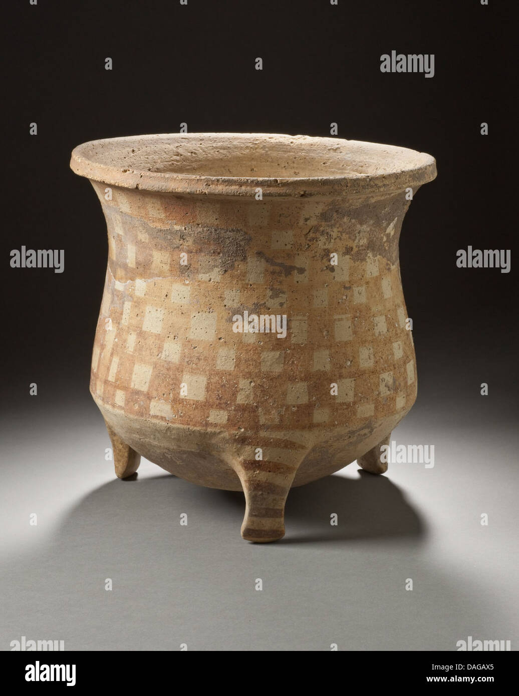 This tripod vessel, made of clay, is from ancient Near Eastern culture ...