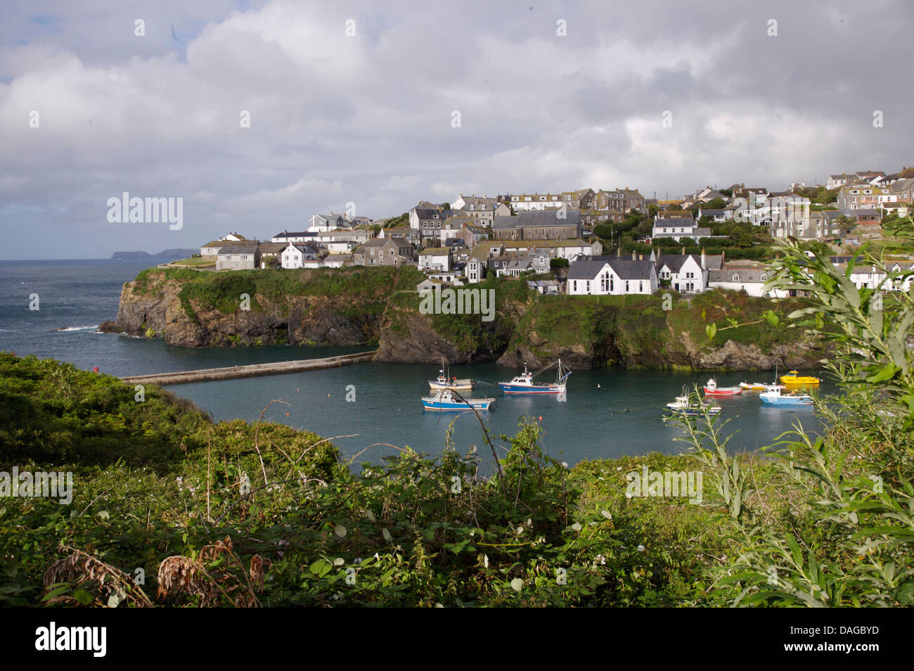 View from cliff top of the Cornish village of Port Isaac with fishing ...