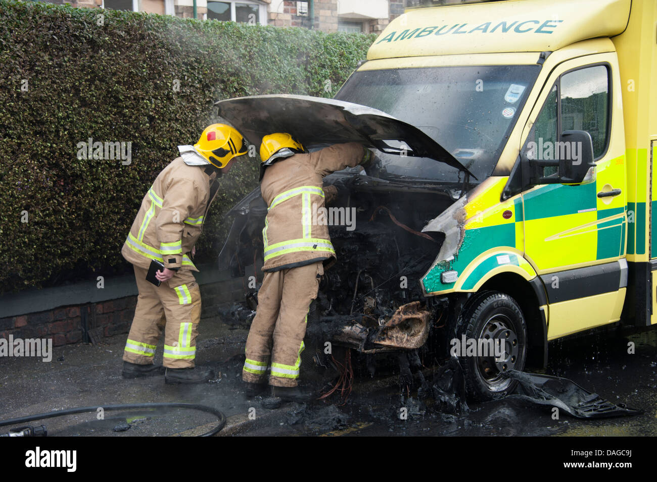 Firefighters tackle ambulance engine on fire Stock Photo - Alamy