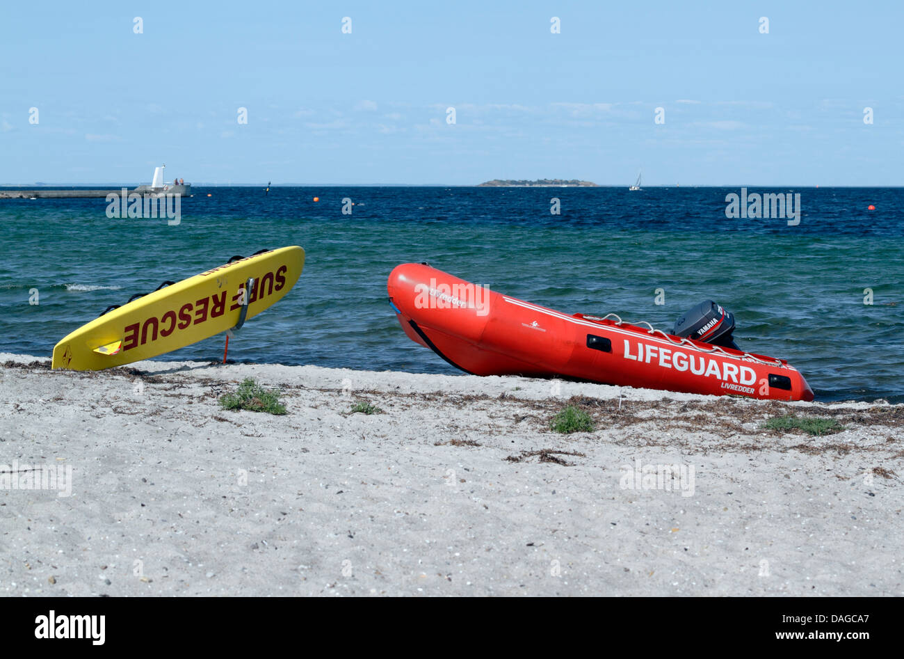 Lifeguard surf rescue board and inflatable lifeboat with outboard motor ...