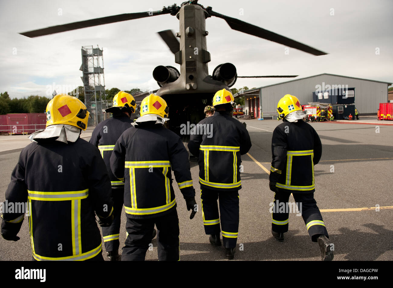 Firemen Firefighters boarding Chinook Helicopter Stock Photo - Alamy