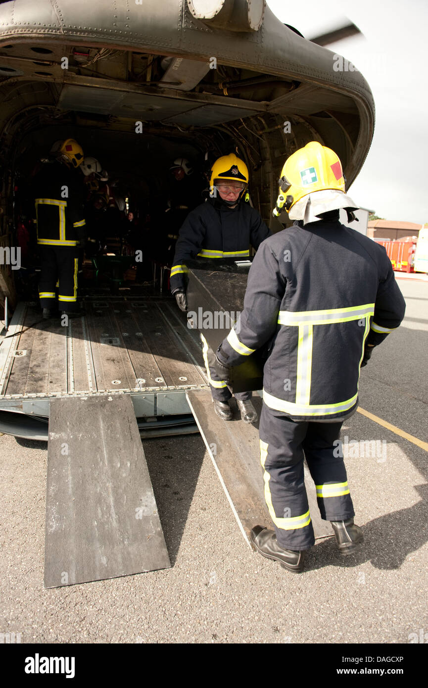 Firemen Firefighters boarding Chinook Helicopter Stock Photo - Alamy