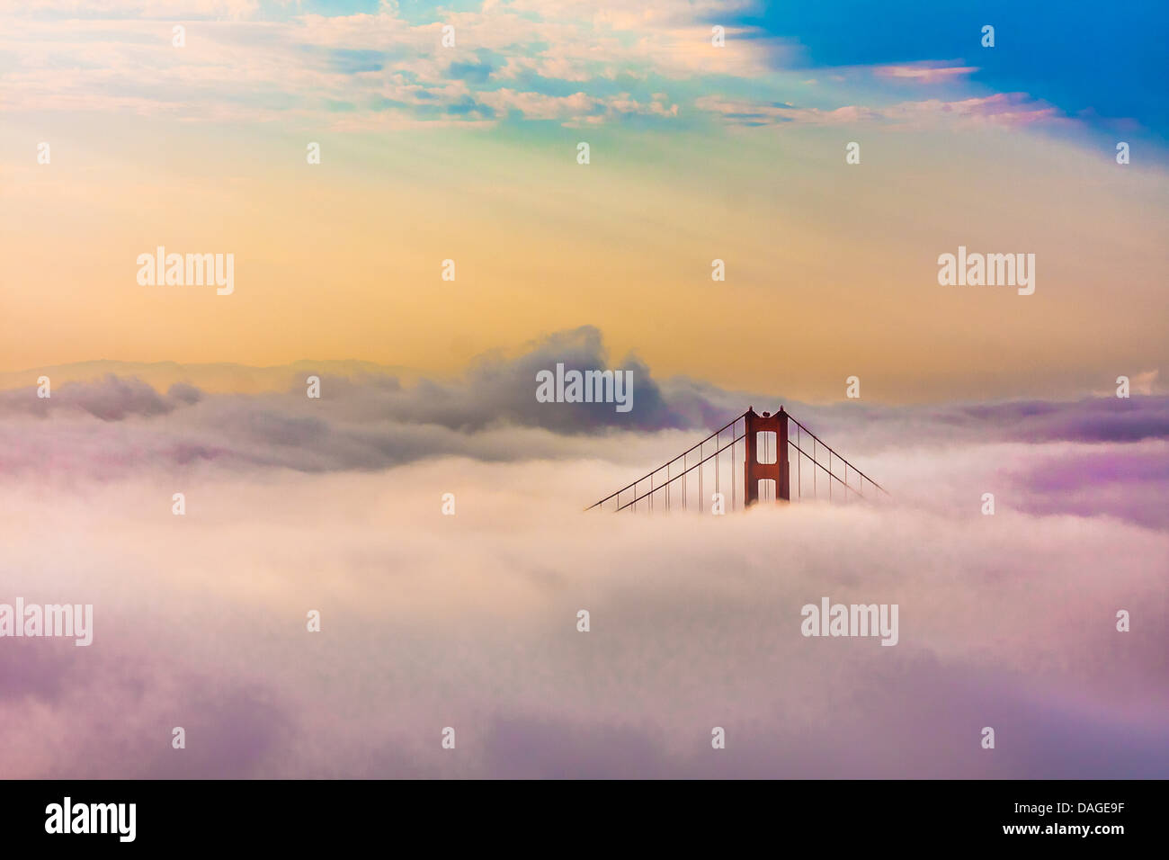 Golden Gate Bridge surrounded by Fog during Sunrise Stock Photo - Alamy