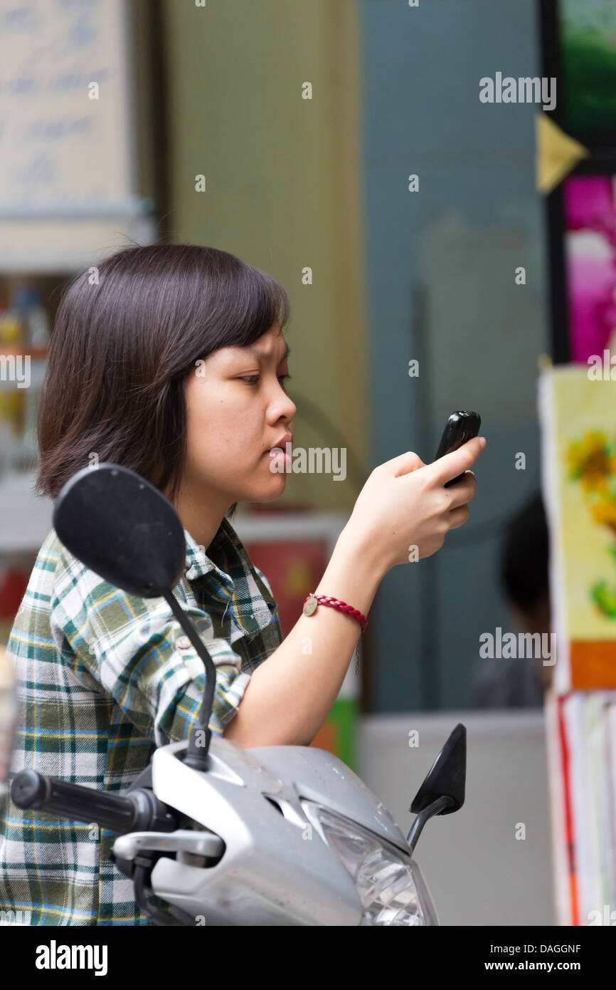 Vietnamese woman smartphone in hi-res stock photography and images - Alamy