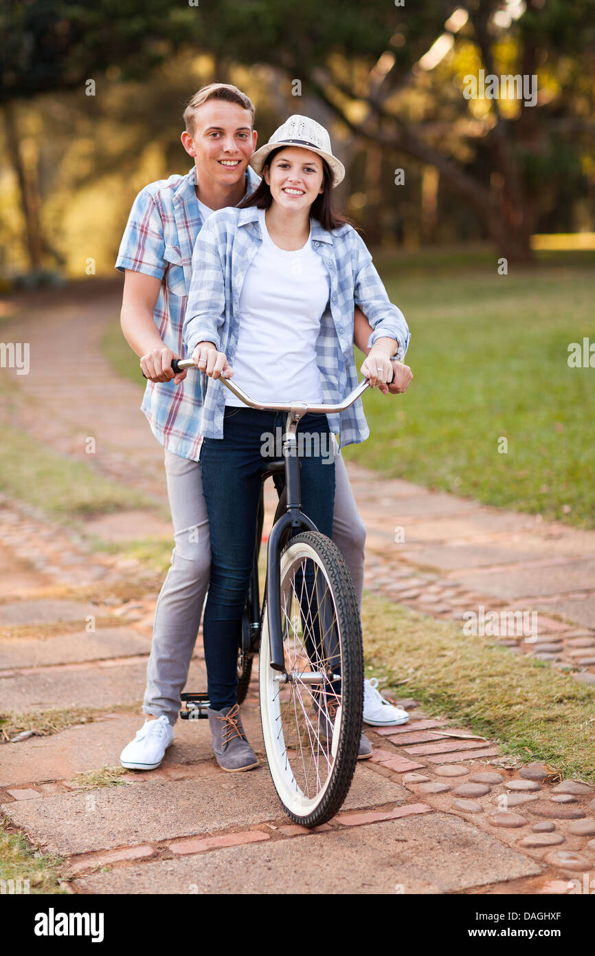 loving teenage couple riding bicycle together outdoors Stock Photo - Alamy
