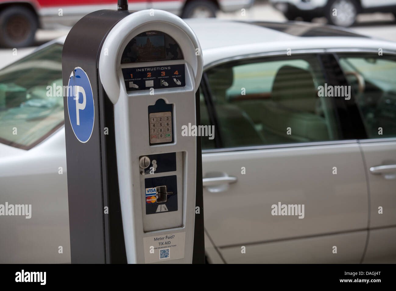 A street meter machine is seen in Milwaukee Stock Photo - Alamy