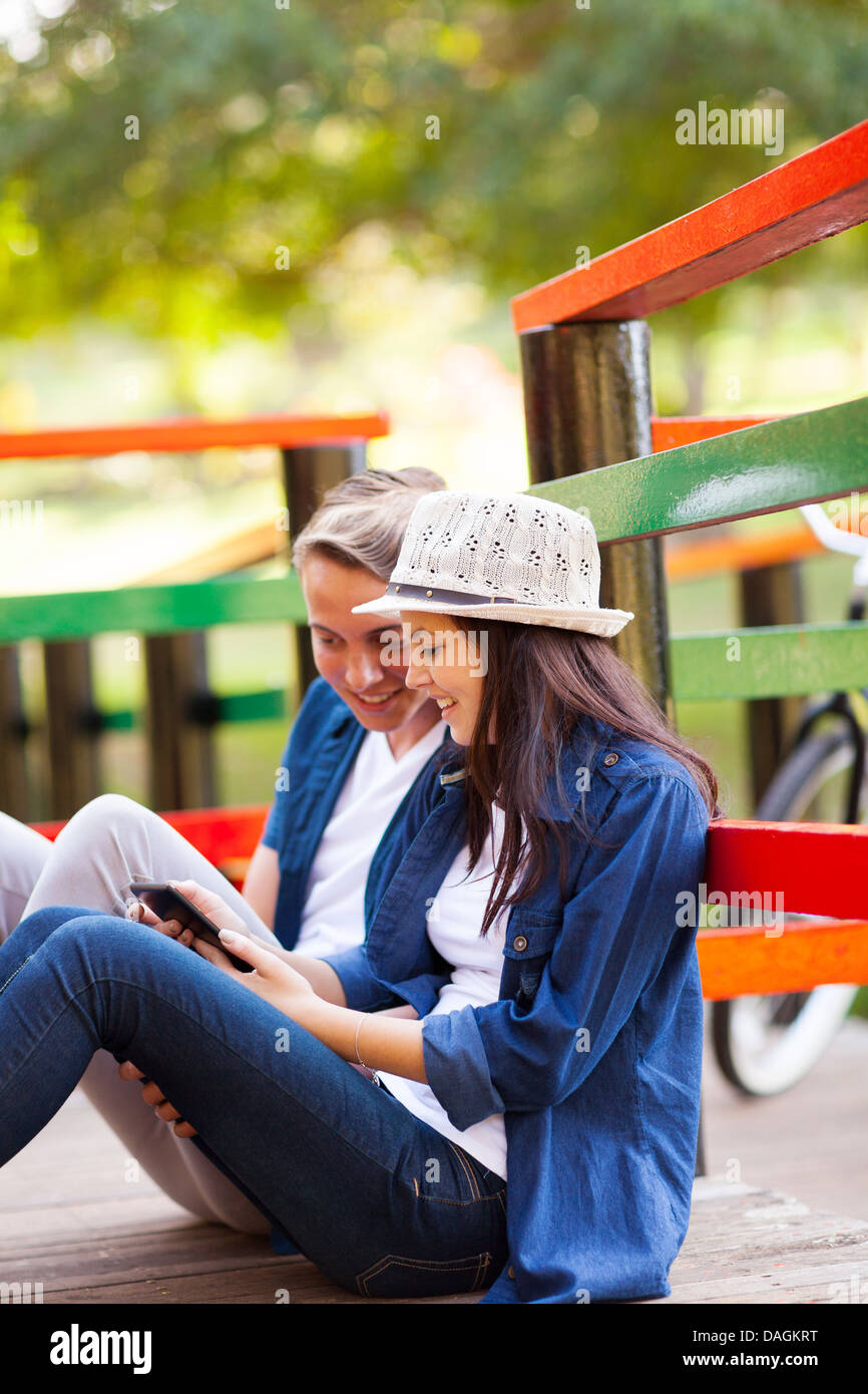 Boy girl sitting on bridge hi-res stock photography and images - Alamy