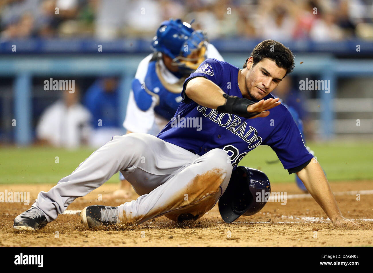 Slides across home plate hi-res stock photography and images - Alamy