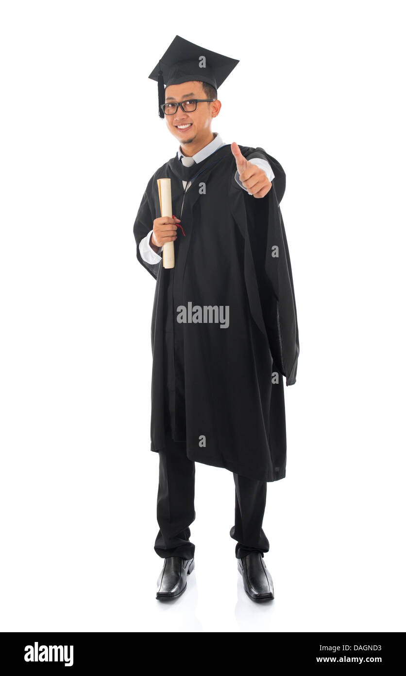 Full body Asian male university student in graduation gown thumb up ...