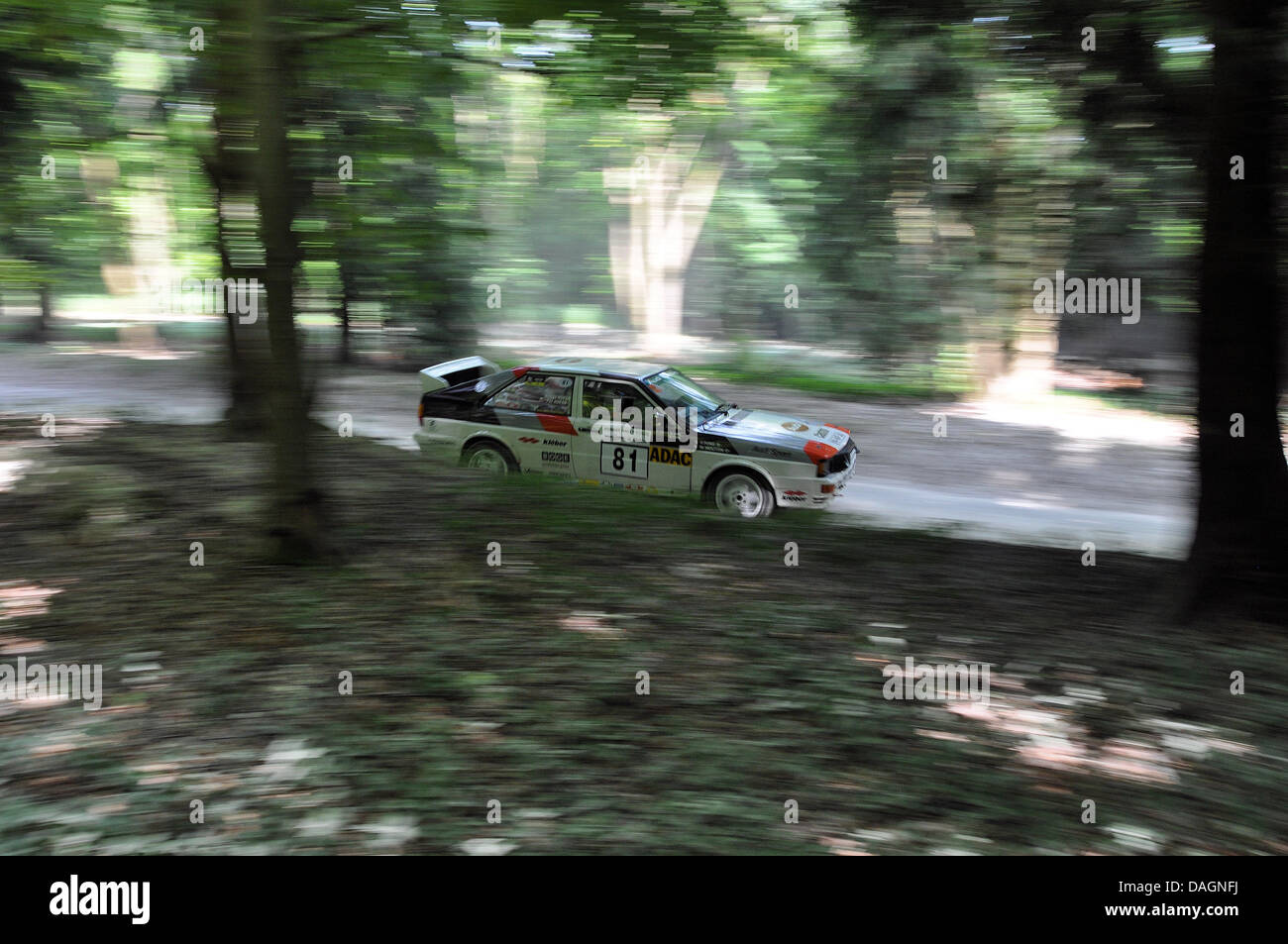 Audi Quattro rally car through forest at speed. The Goodwood Festival ...