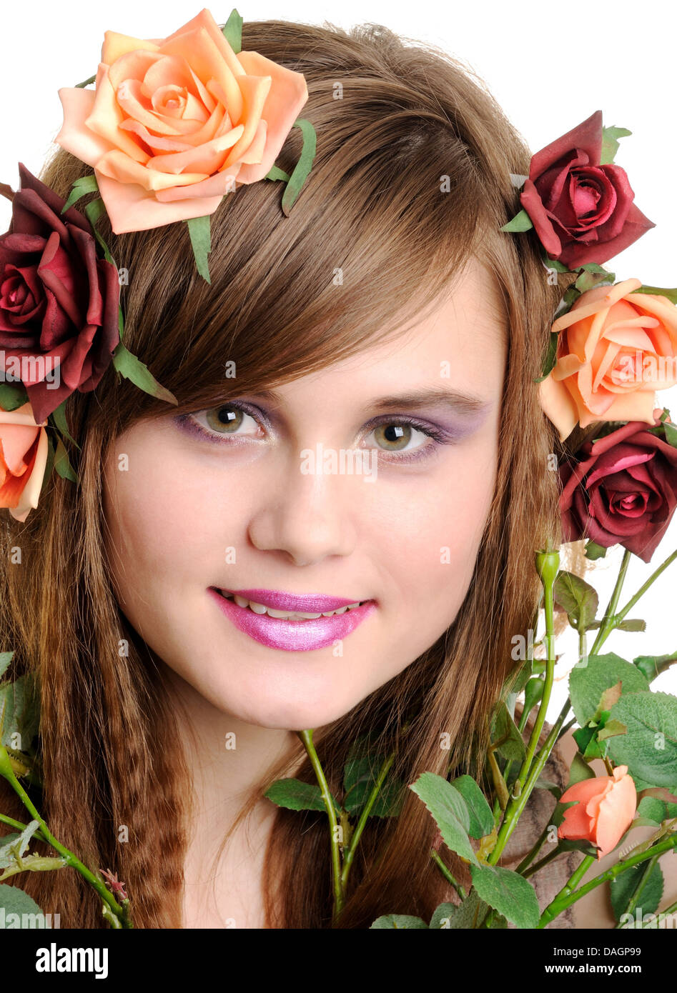 Beautiful smiling girl with roses, portrait close up Stock Photo - Alamy