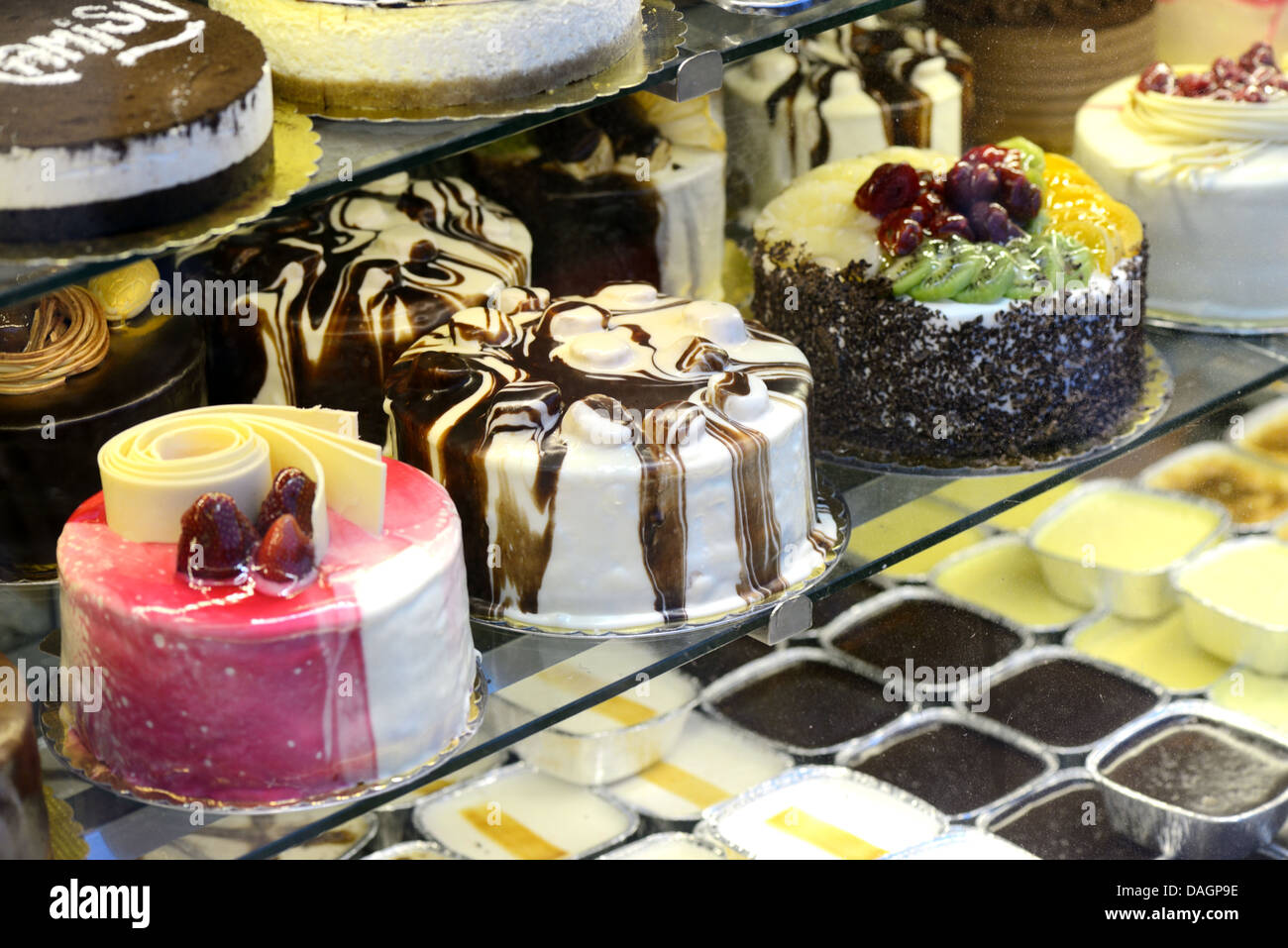 Cakes assortment in a shop window Stock Photo - Alamy