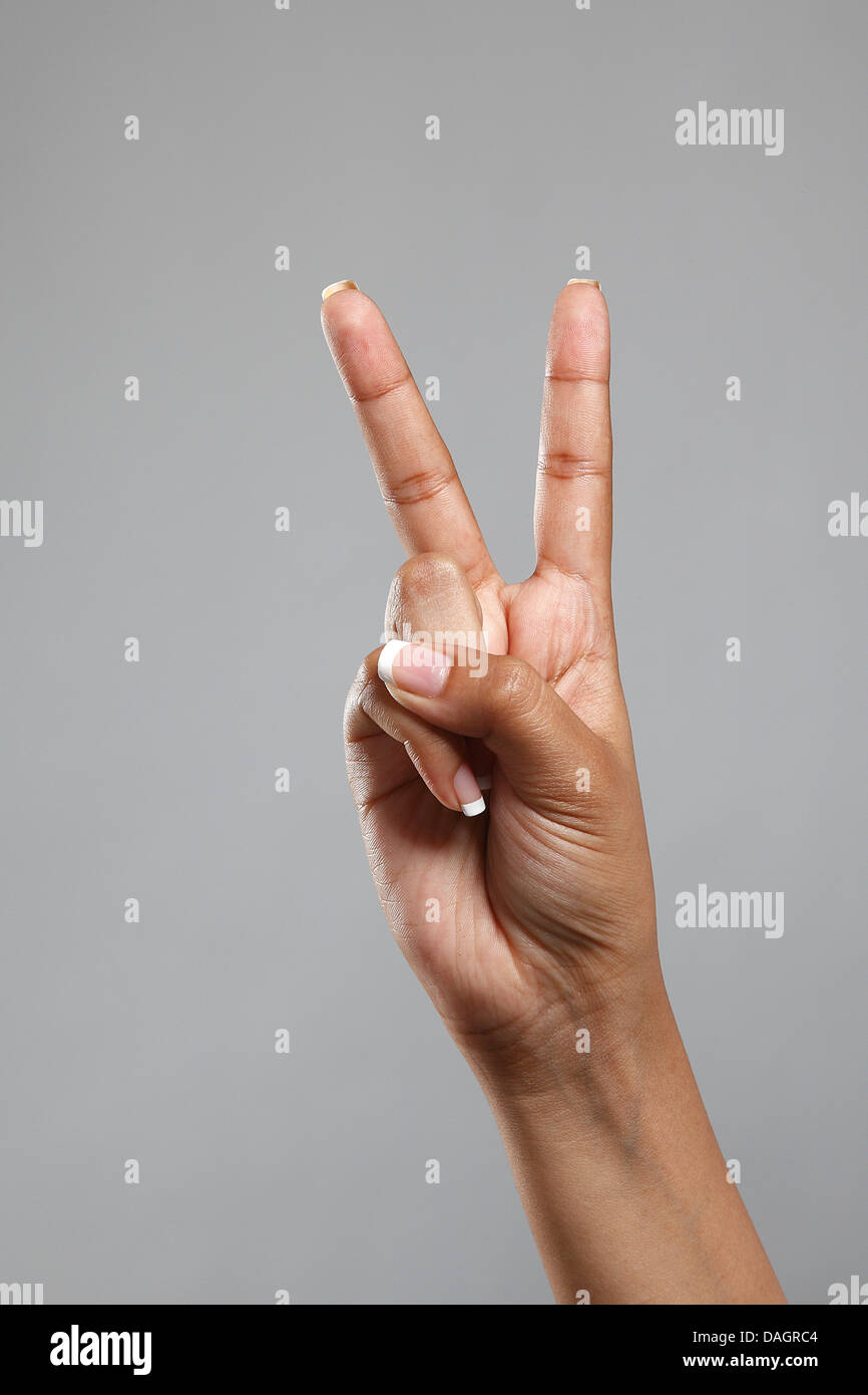 Woman's hand counting two Stock Photo - Alamy