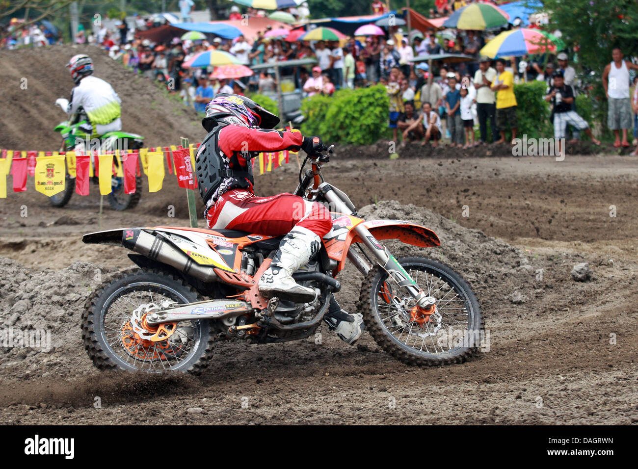 Koronadal, Philippines. 12th July, 2013. Motorcycle riders jump and ...