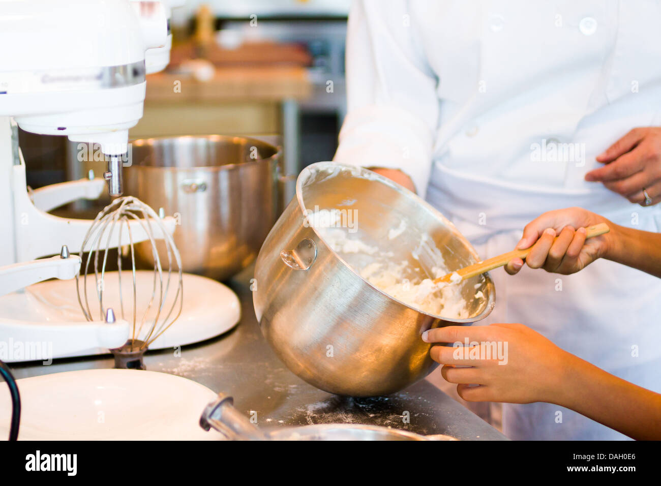 Kinds in cooking class learning how to cook and bake Stock Photo - Alamy