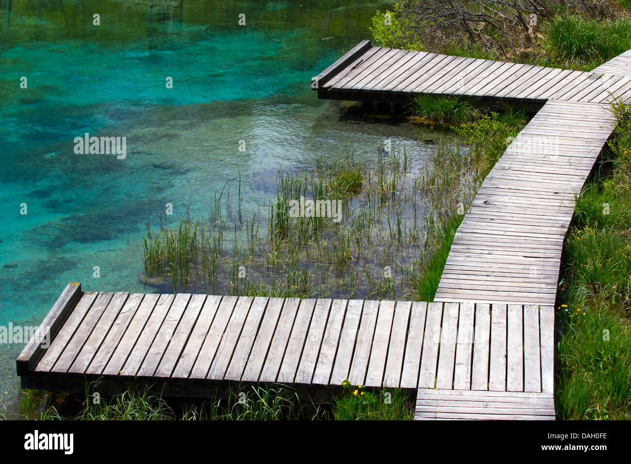 Pair of small wooden piers by the lake Stock Photo - Alamy