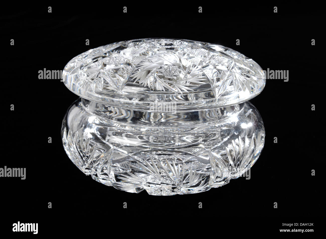 A lead glass (crystal) dressing table box, brilliantly cut with a ...