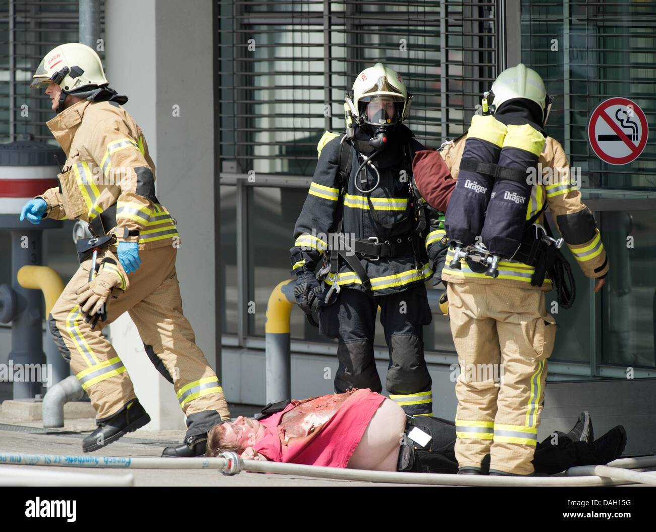 Fire fighters, rescue workers and police officers practice for an ...