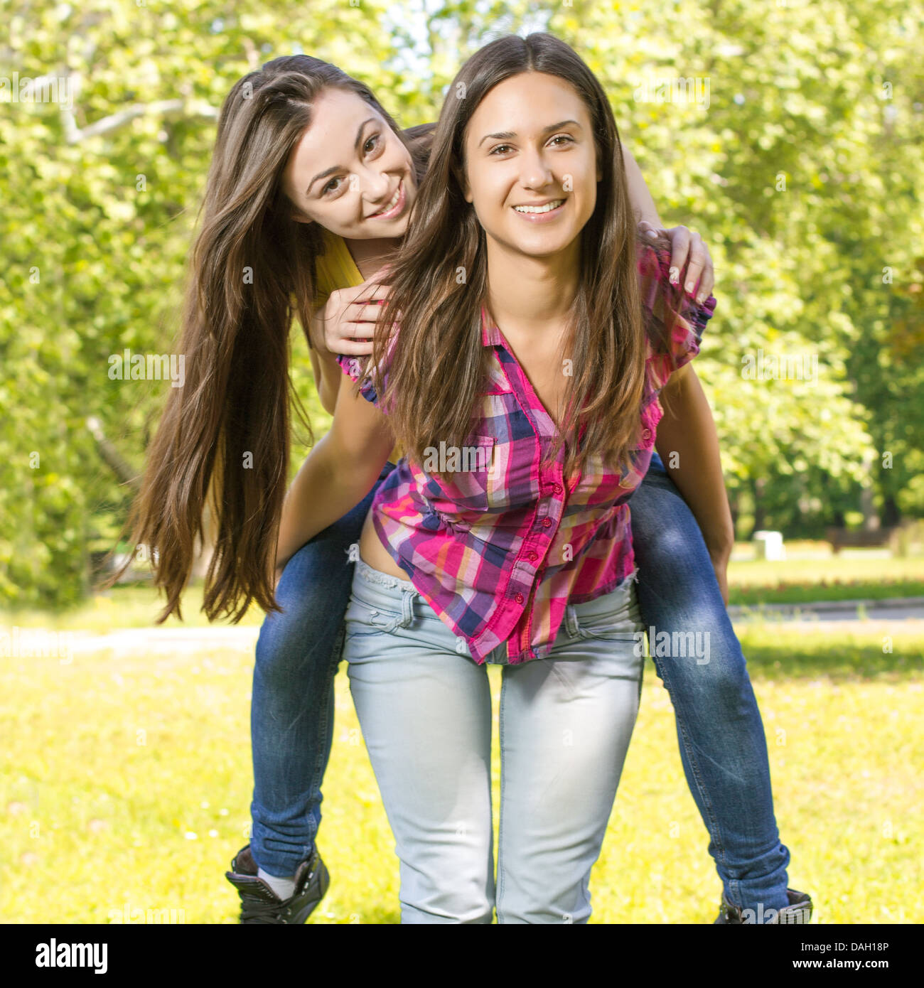 Happy teenage girl having fun in the park Stock Photo - Alamy