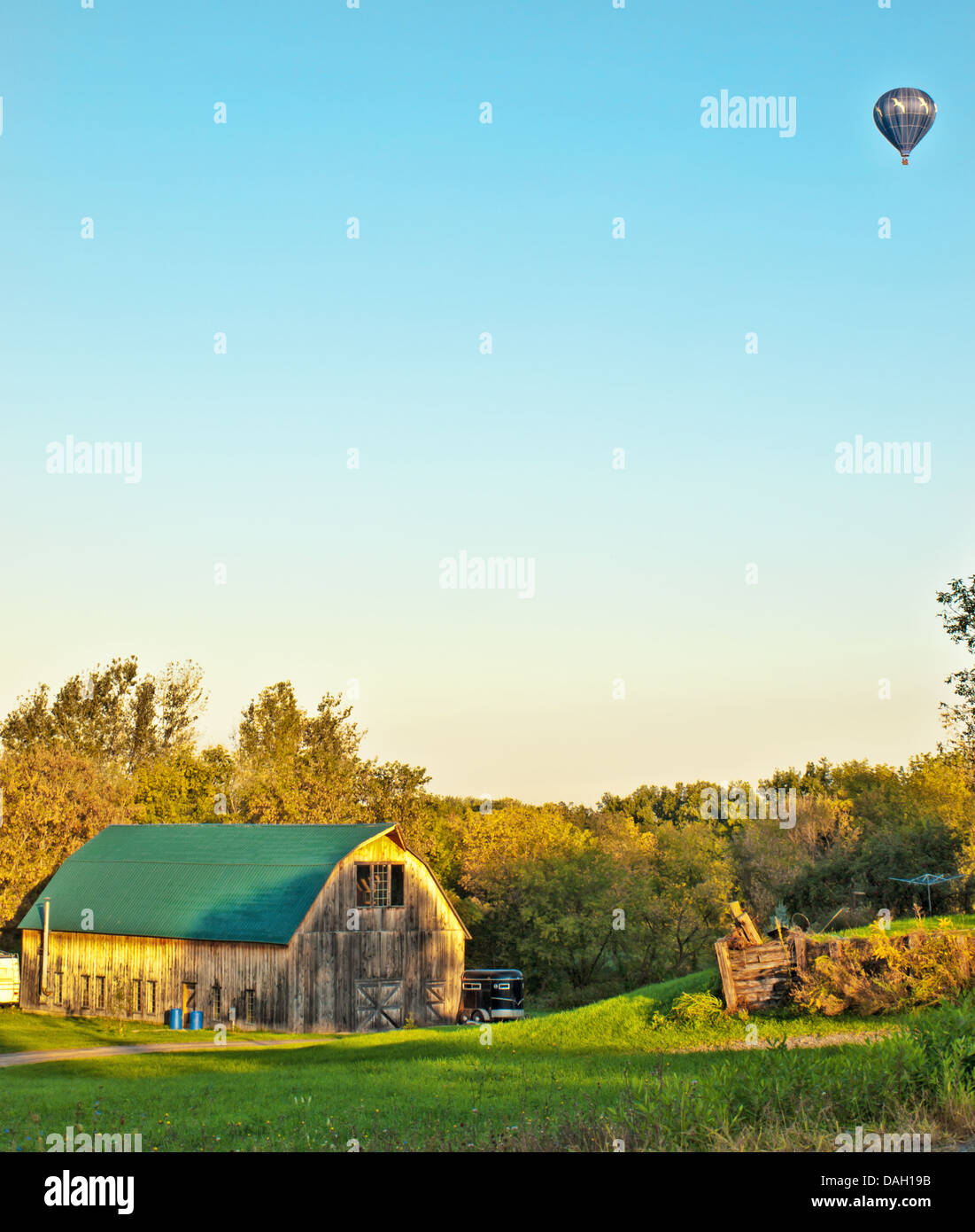 barn with hot air balloon on an autumn morning Stock Photo - Alamy