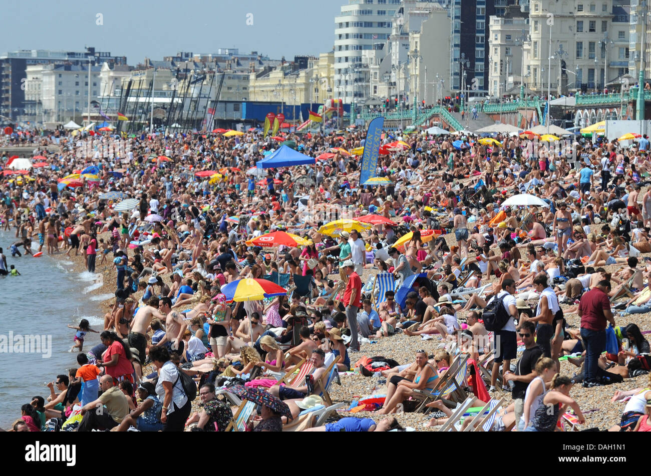 Brighton UK 13 July 2013 - Brighton beach is absolutely packed with ...