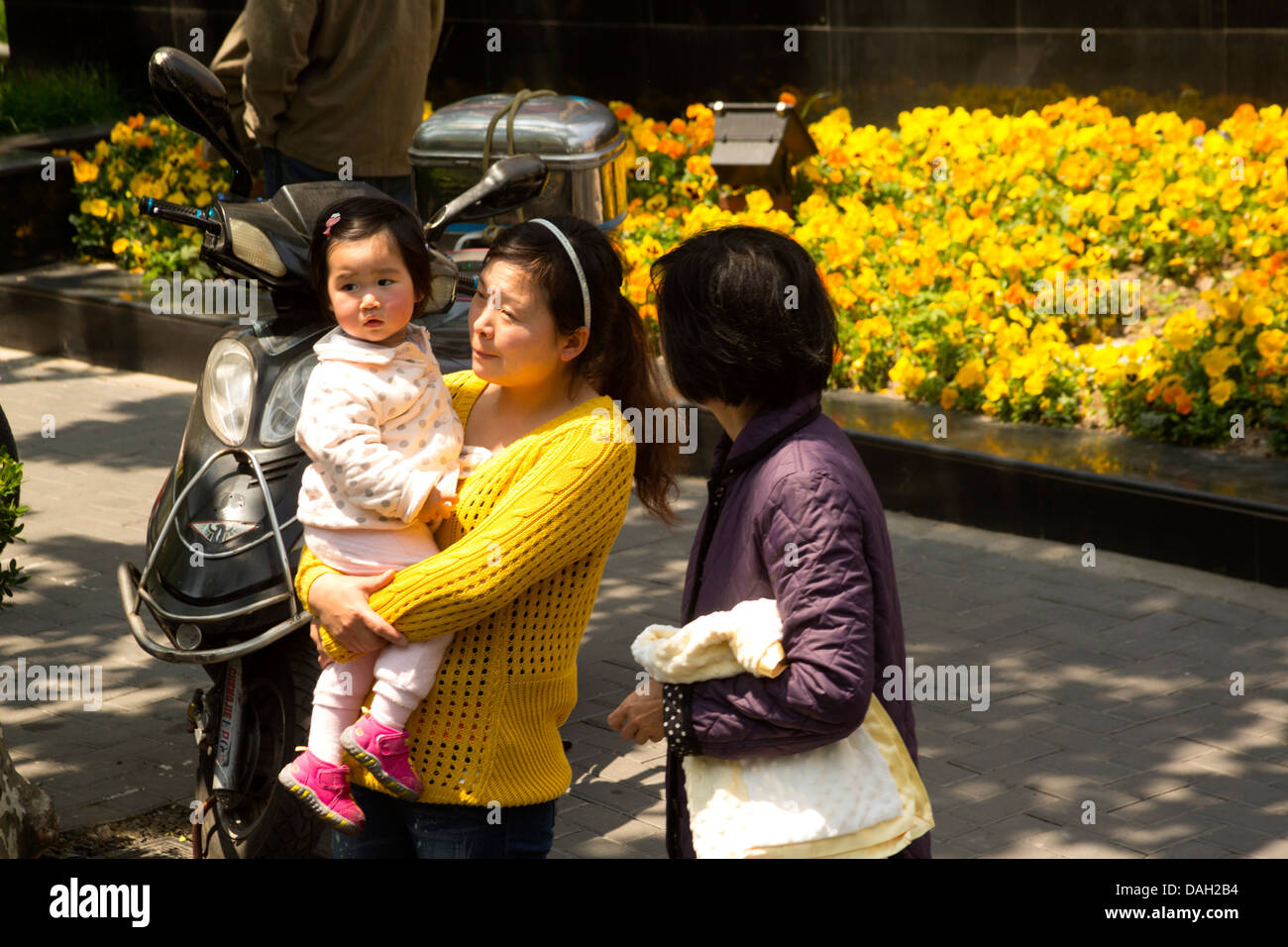 Three generations of women on a Shanghai street China Stock Photo - Alamy