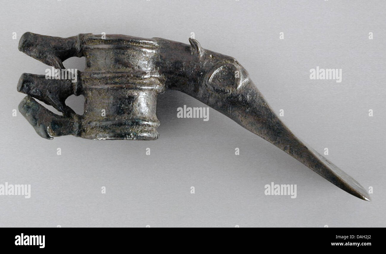 An adze-head, an ancient tool used for carving and shaping wood ...