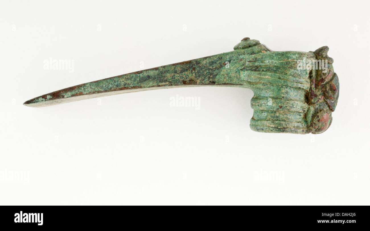 This adze-head, a type of ancient tool, reflects craftsmanship from an ...
