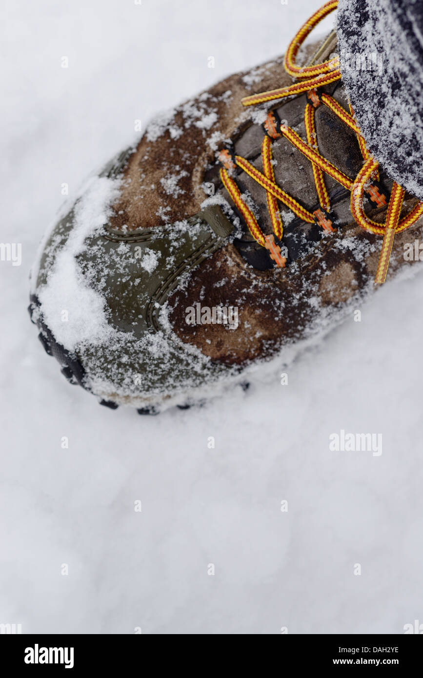 Winter boot covered in snow Stock Photo - Alamy