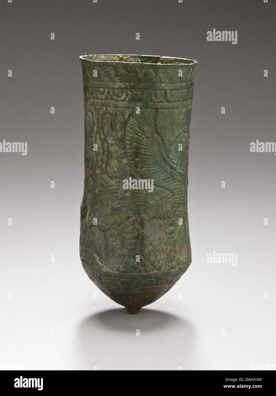 This beaker represents ancient craftsmanship, showcasing a functional ...
