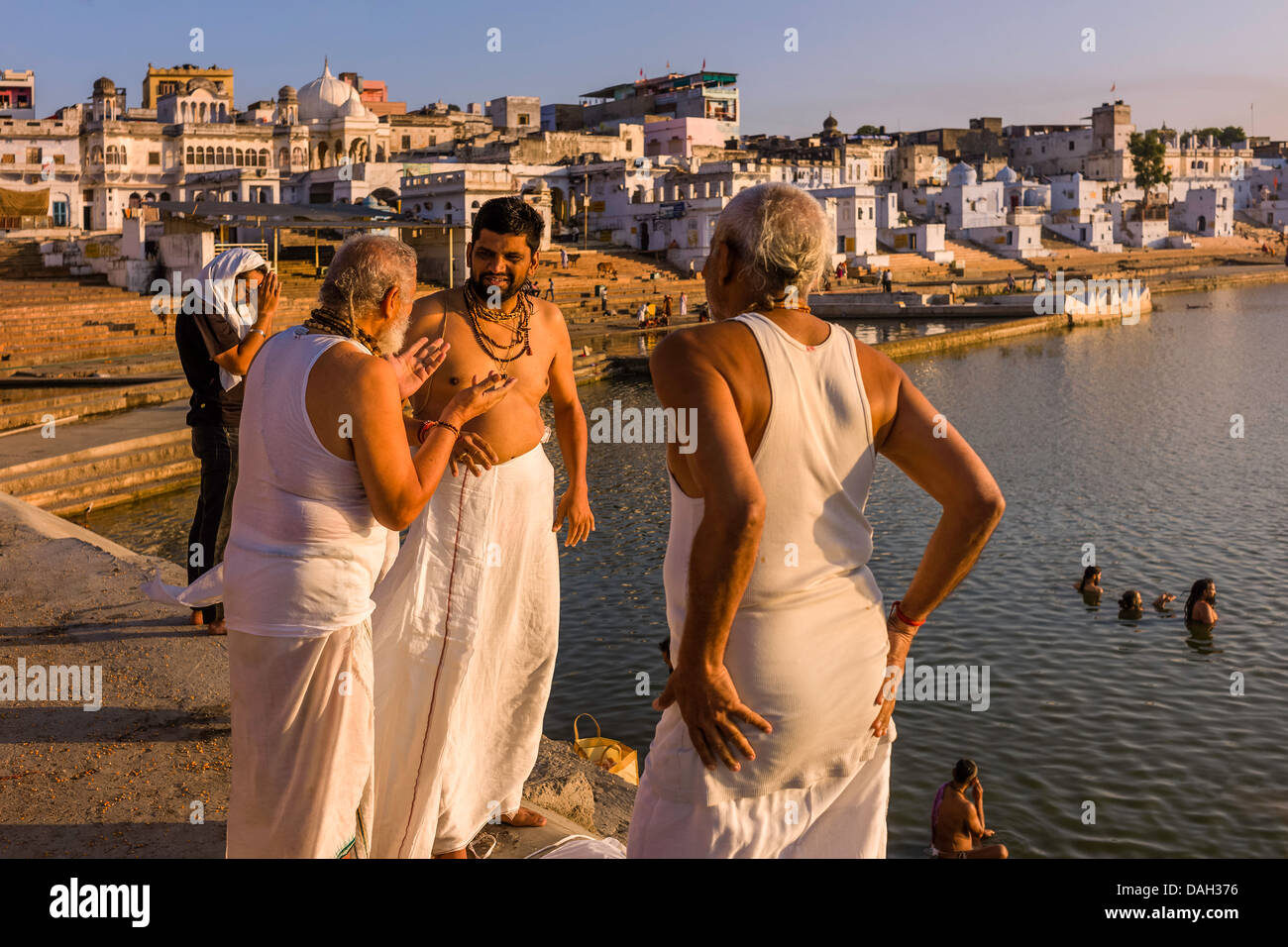 Pilgrims pray and take a ritual bath in the holy lake at Pushkar ...