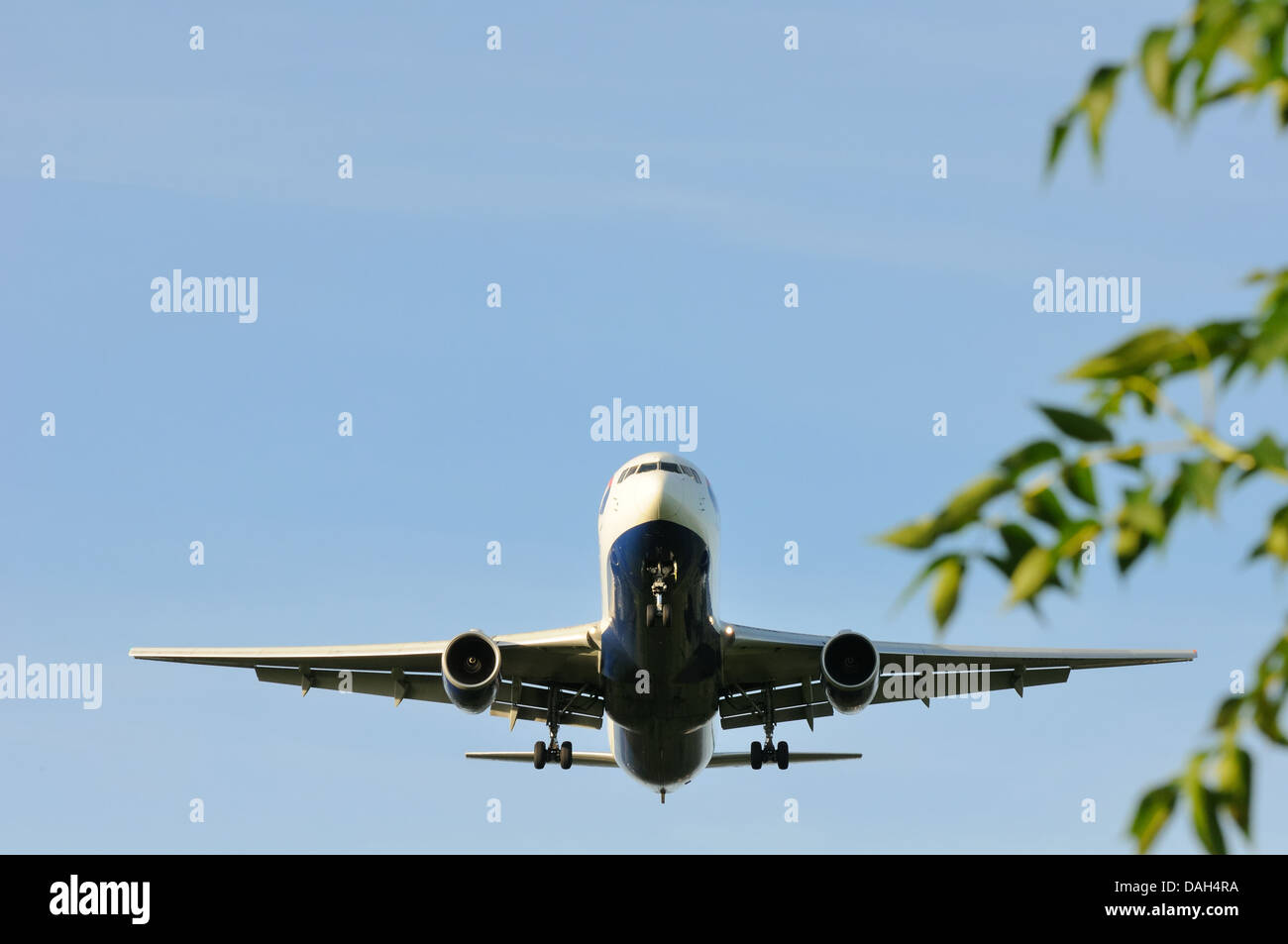 A large aircraft seconds from landing Stock Photo - Alamy