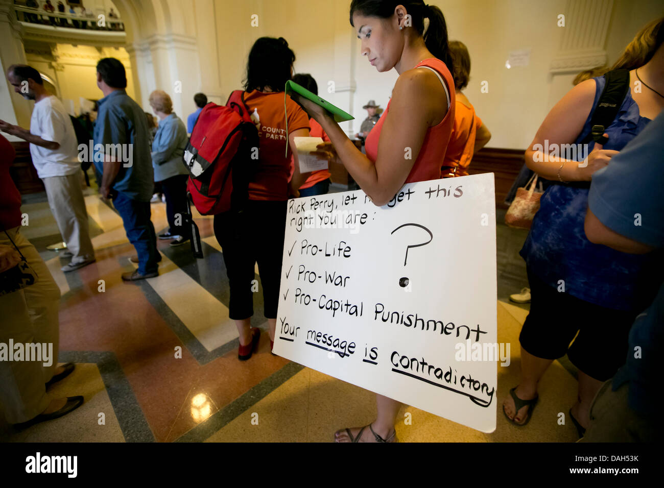 Hundreds of pro-life and pro-choice activists crowd inside the Texas ...