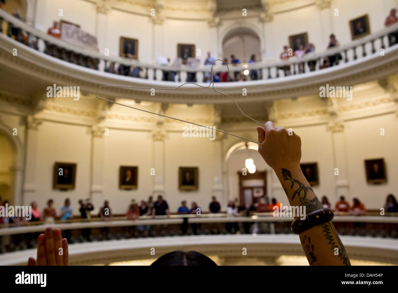 Hundreds of pro-life and pro-choice activists crowd inside the Texas ...