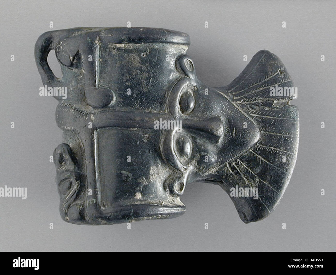 This bronze crescentic axehead from the ancient world showcases a ...