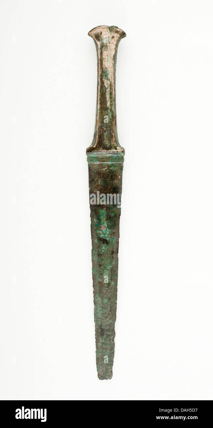 This dagger showcases an elegant design, featuring intricate ...