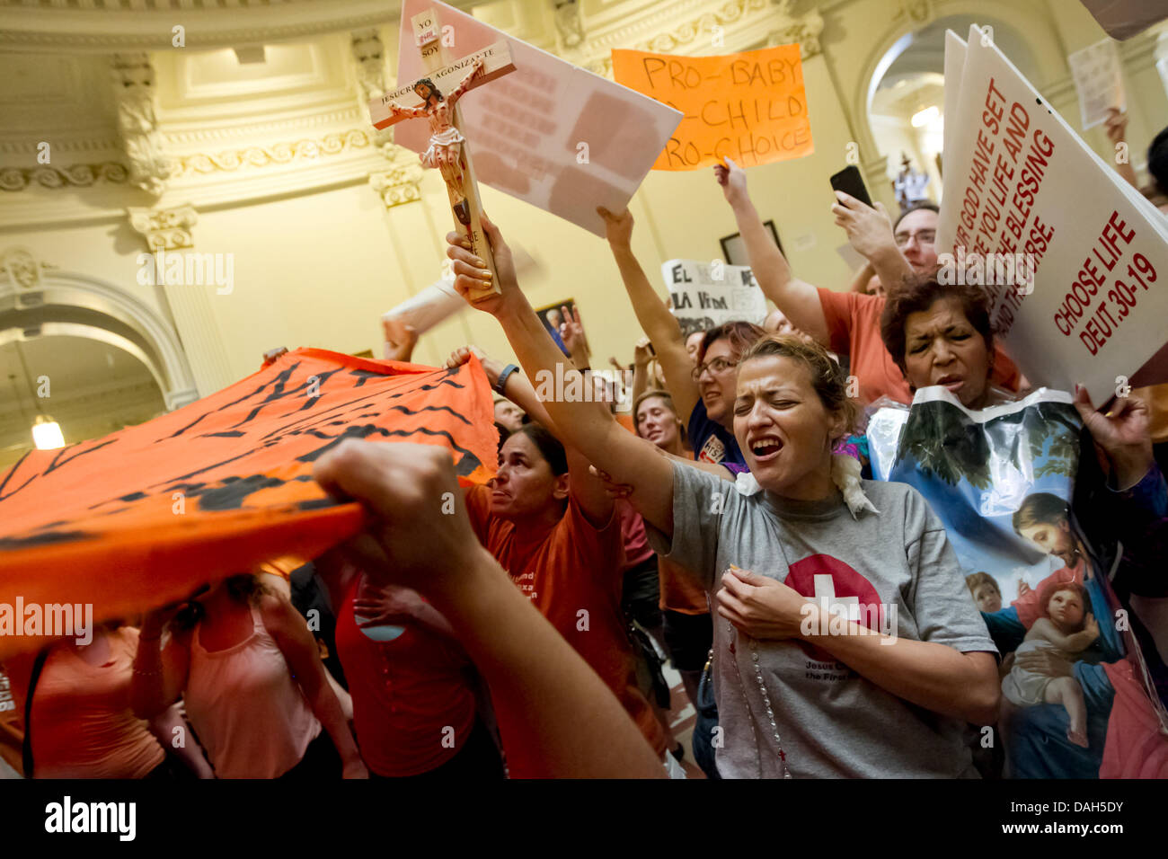 Hundreds of pro-life and pro-choice activists crowd inside the Texas ...