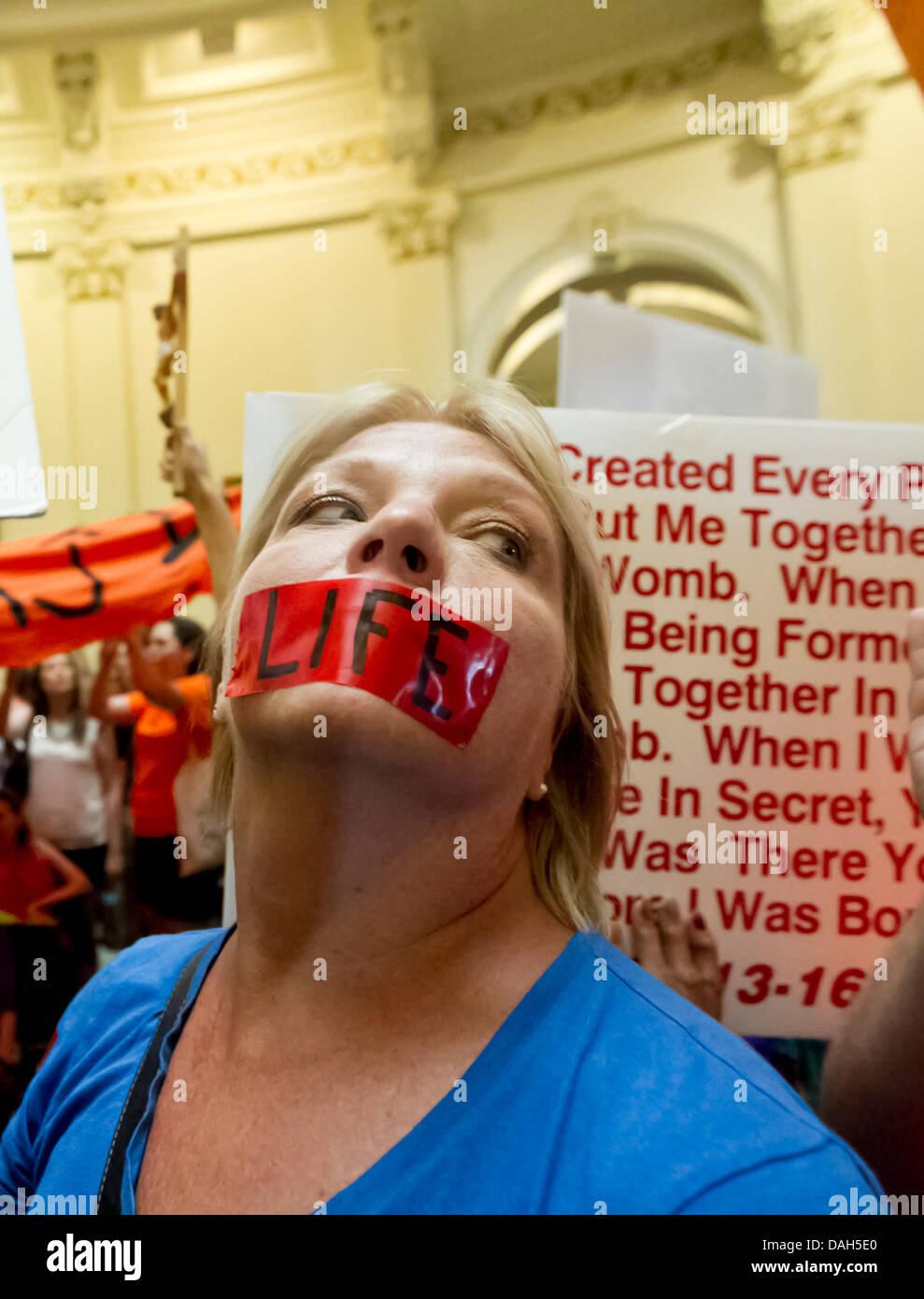 Hundreds of pro-life and pro-choice activists crowd inside the Texas ...