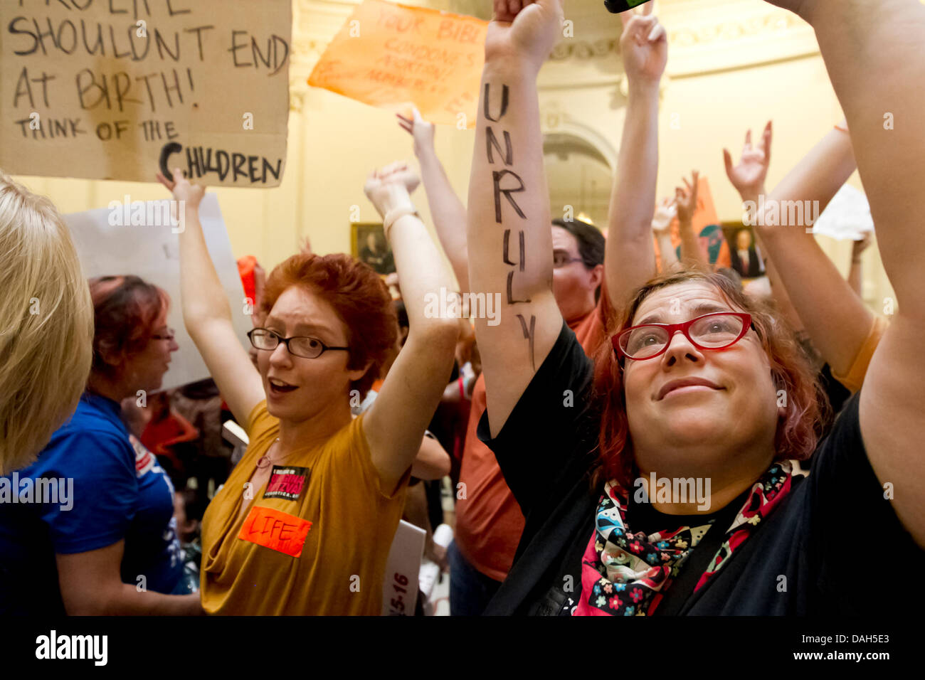 Hundreds of pro-life and pro-choice activists crowd inside the Texas ...