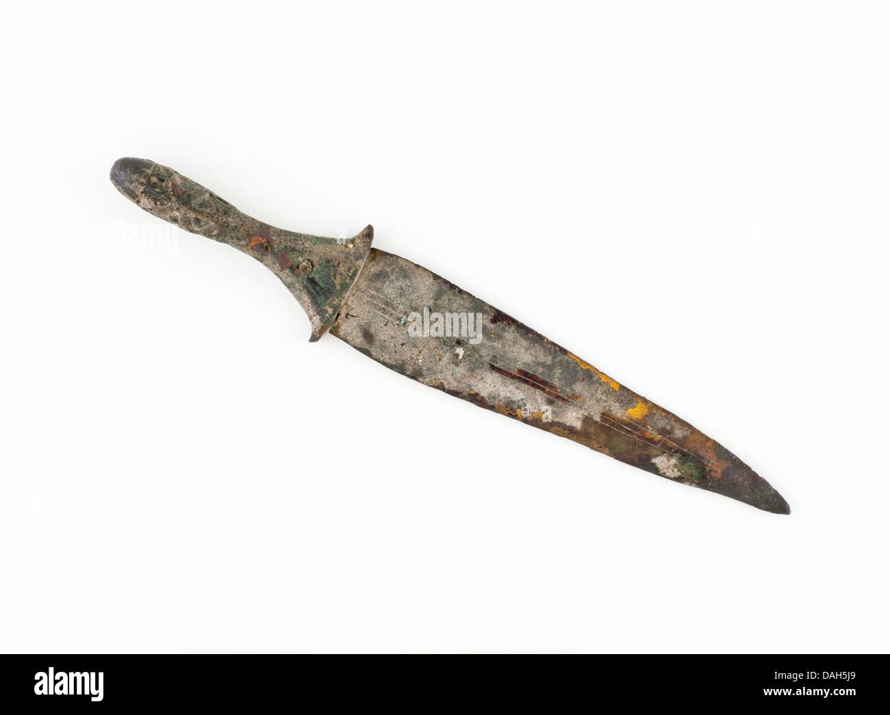 This ancient dagger, crafted from metal with intricate designs, was ...