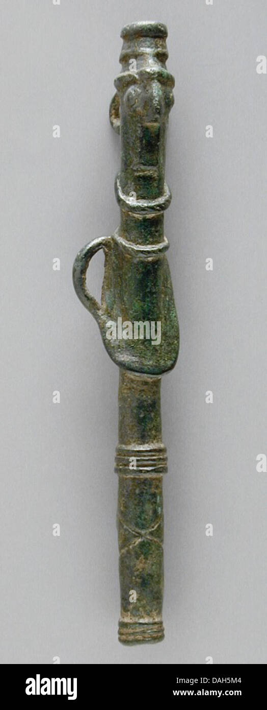 A decorated tube from an ancient culture, possibly used as a ceremonial ...