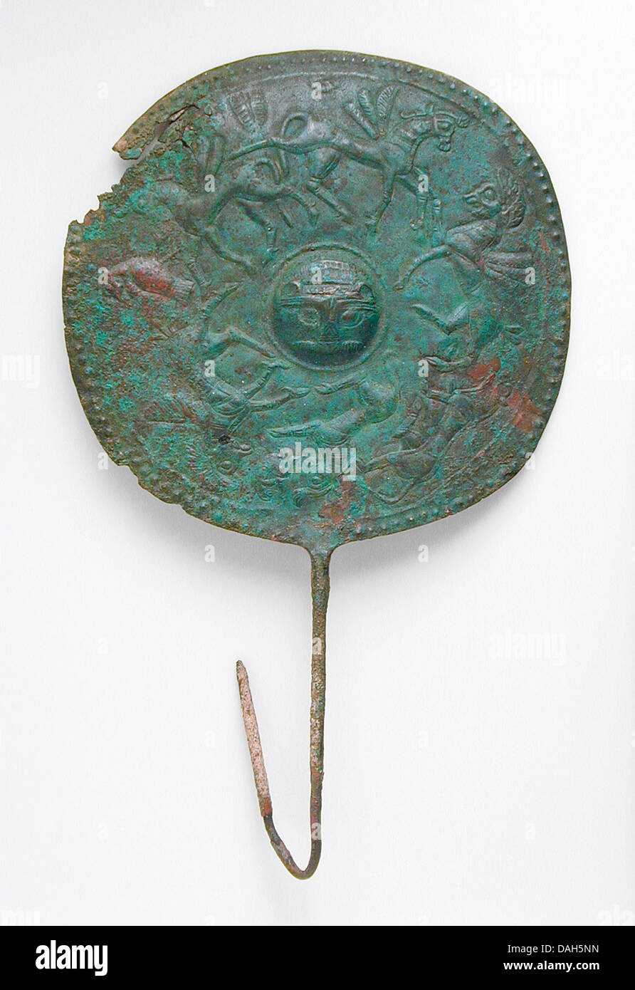 A disc-headed pin, crafted from bronze and designed for ornamental use ...