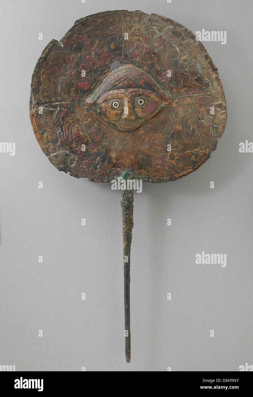 This disc-headed pin, made from bronze, is an example of ancient ...