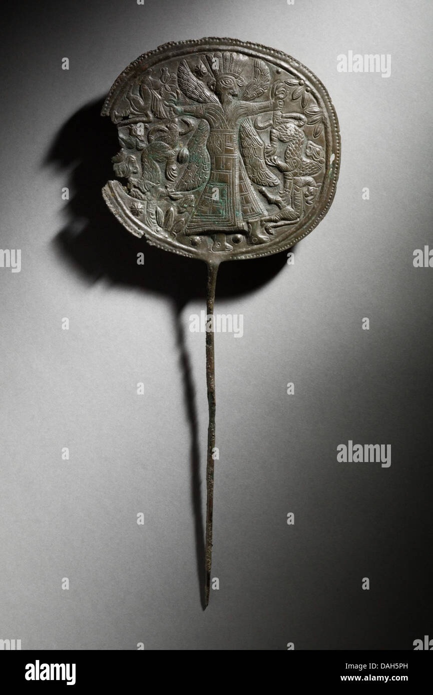 This disc-headed pin is a fine example of ancient adornment, crafted ...