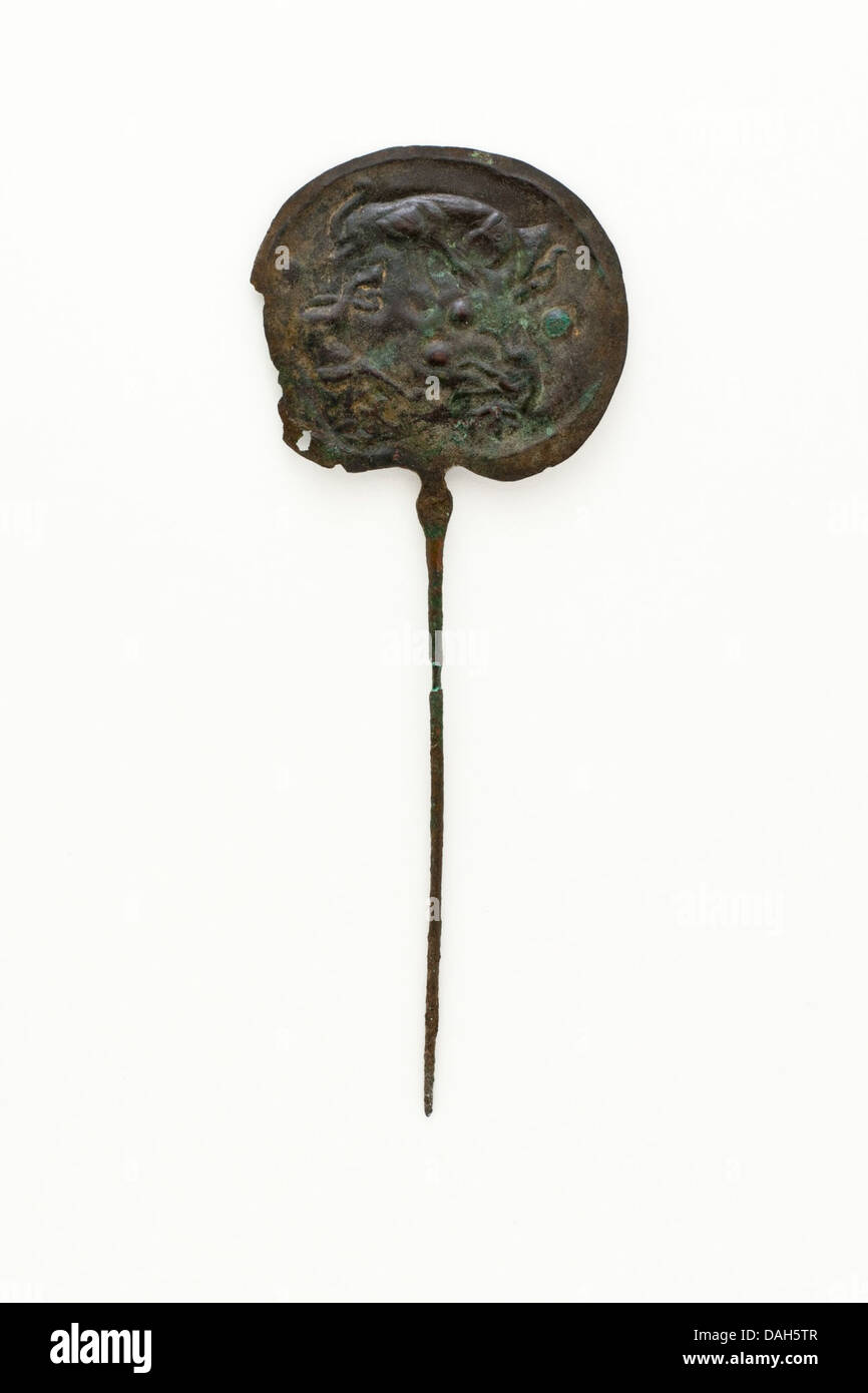This pin features a disc-shaped head, crafted from metal and used as a ...