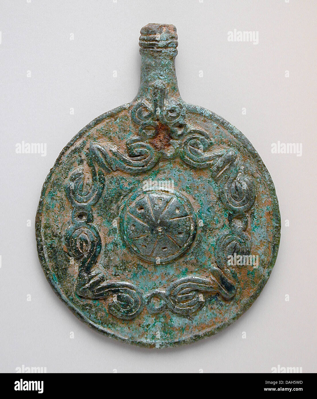 This disc-headed pin is a functional and decorative object from ancient ...