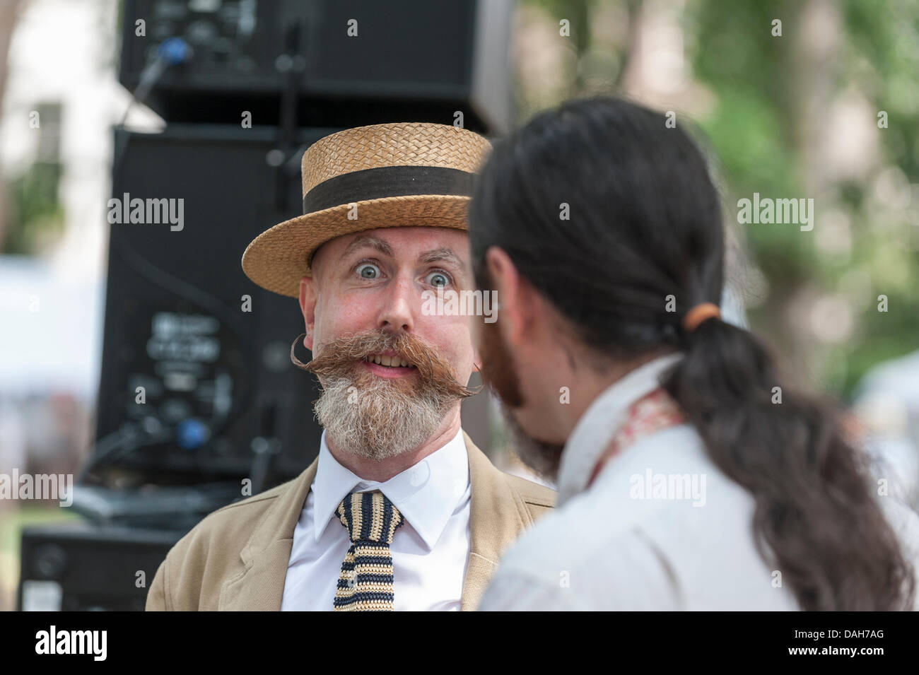 London, UK. 13 July 2013. A gentleman with a fine moustache and beard ...