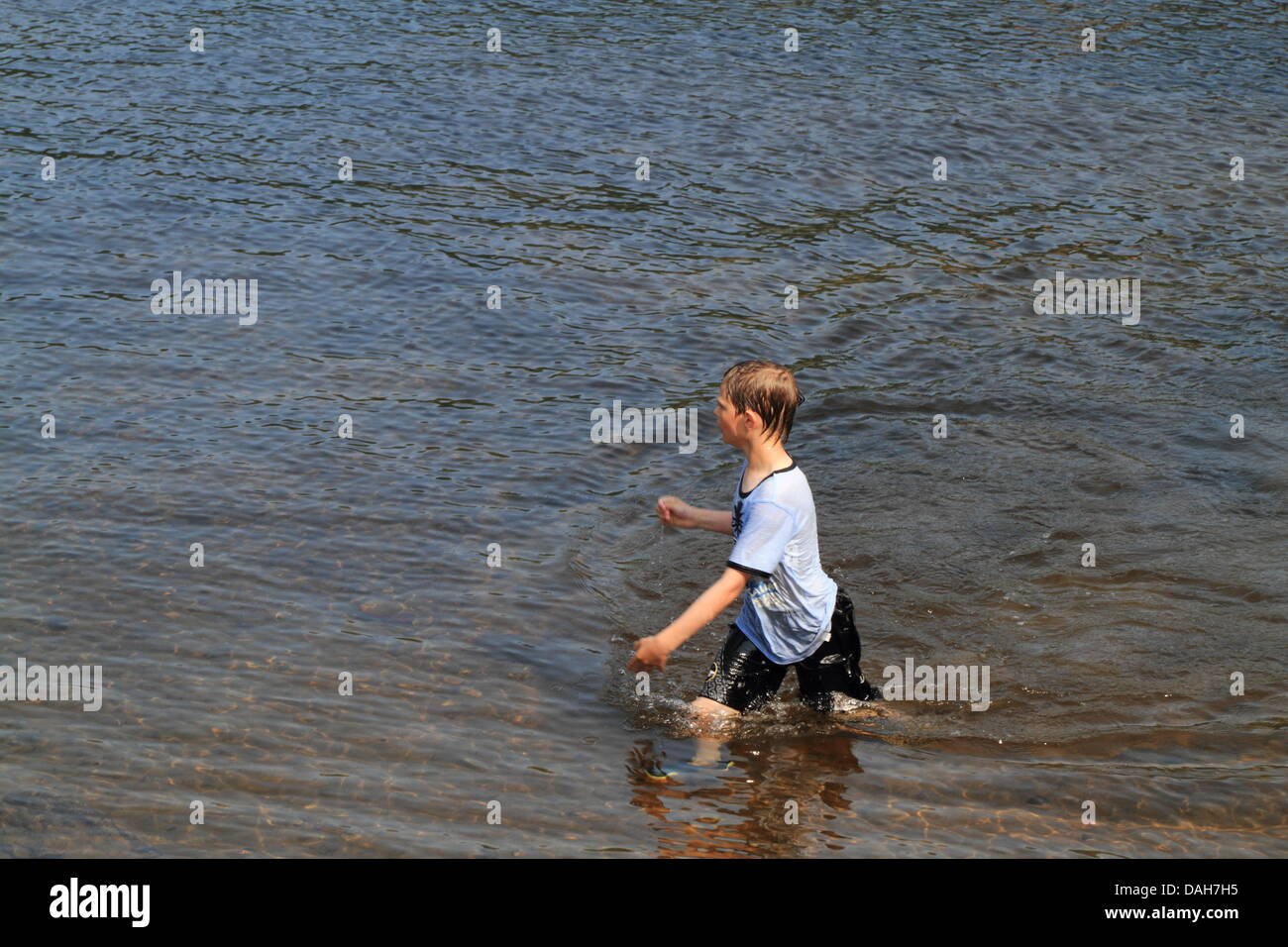 Young Boy Relaxing By The River High Resolution Stock Photography and ...